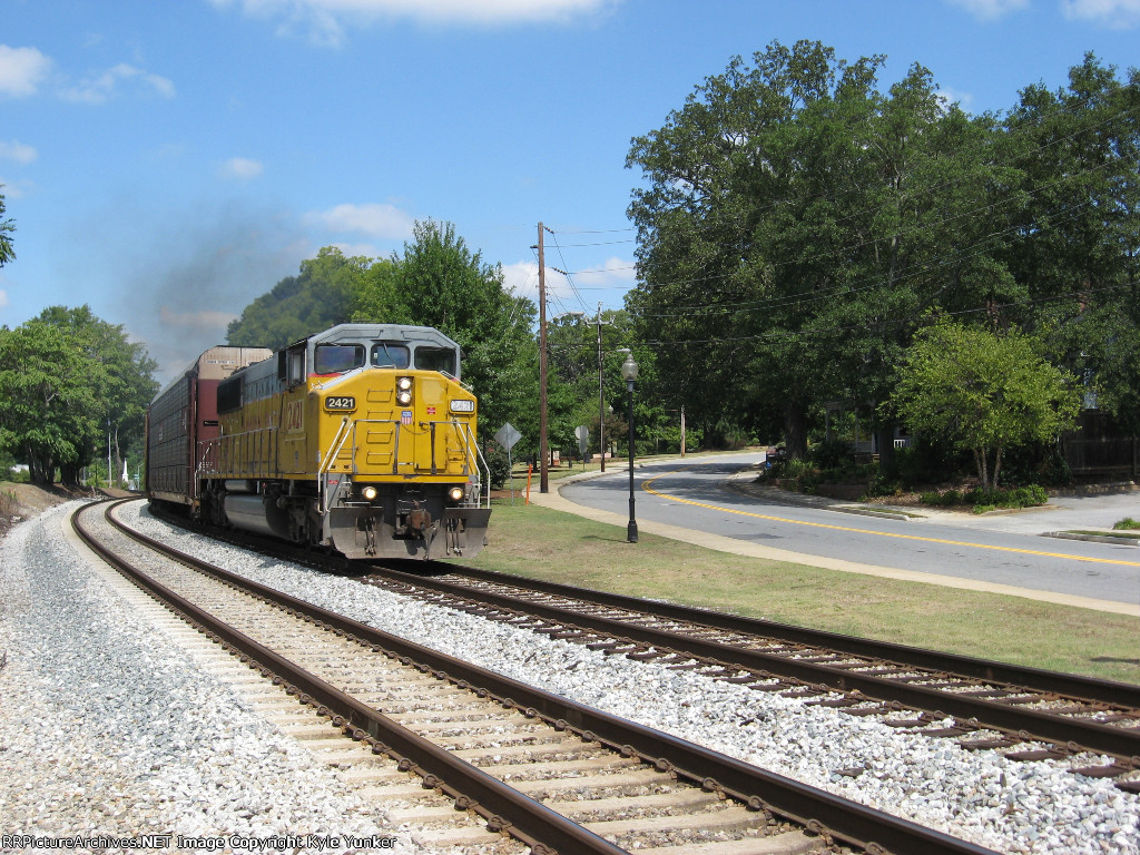 SB autorack train with a triclops leader